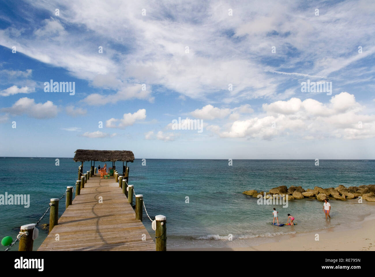 Wooden pier at Hotel Compass Point Resort at Love beach Nassau, Bahamas ...