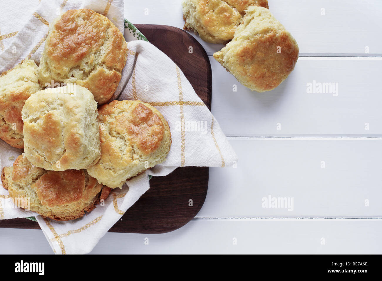 Fresh buttermilk southern biscuits or scones over a white table shot ...