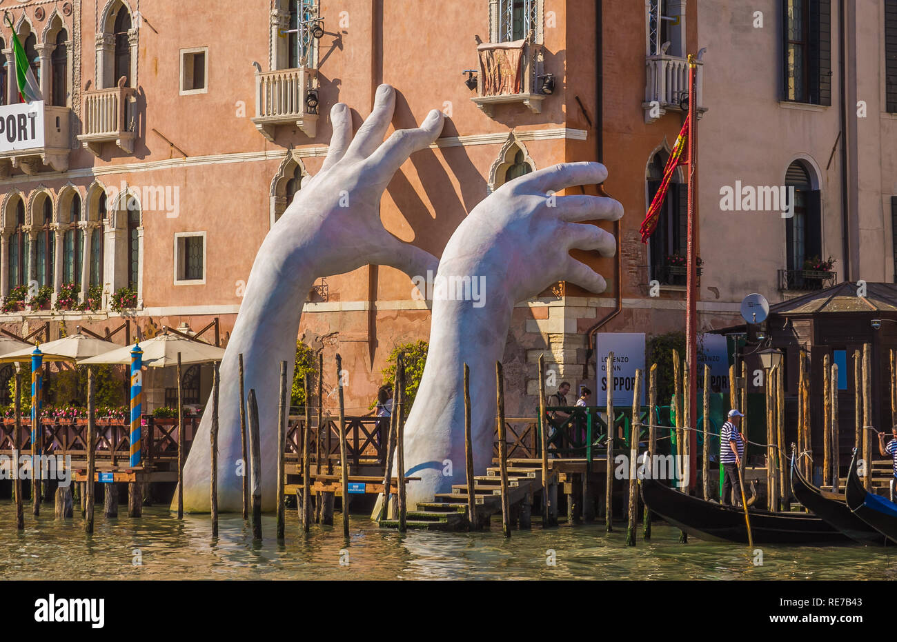 VENICE, ITALY - MAY 23, 2017: Monumental hands rise from the water in ...