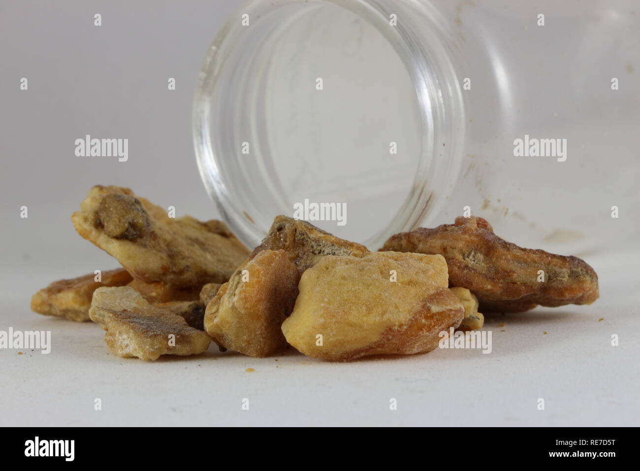 Natural aromatic incense benzoin resin isolated with a bottle on ...