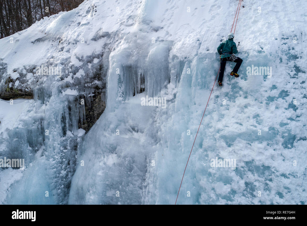 Ice climbing the North Greece, man climbing frozen waterfall Stock ...