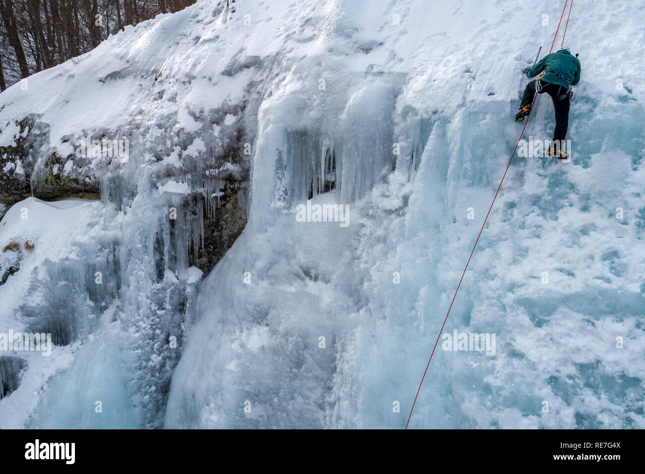 Ice climbing the North Greece, man climbing frozen waterfall Stock ...