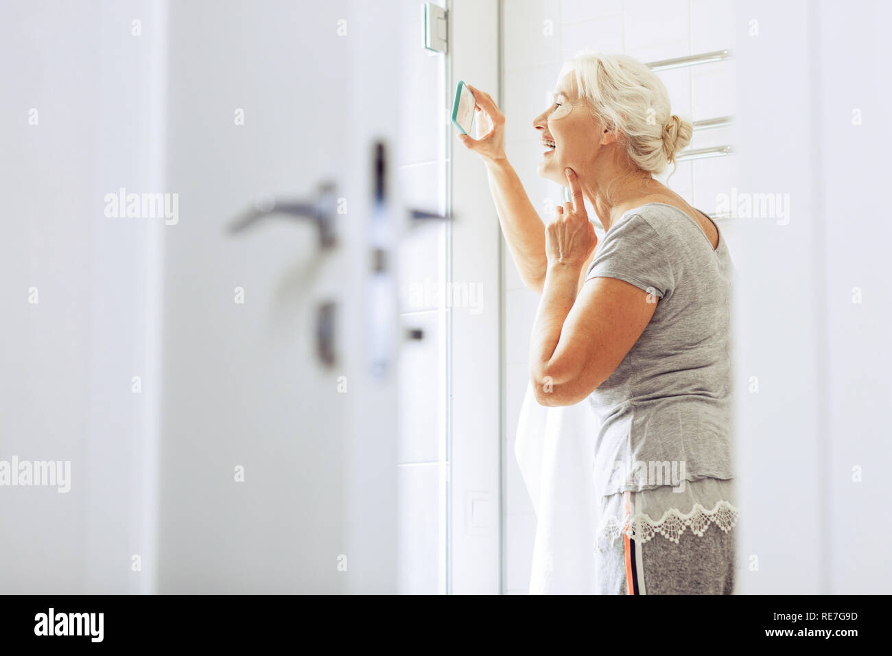 Positive joyful woman looking into the camera Stock Photo - Alamy