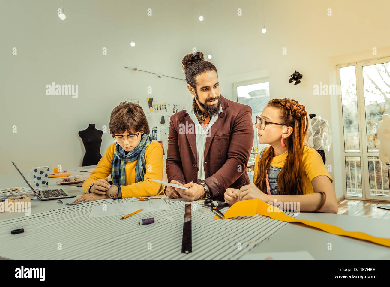 Listening attentively to children hi-res stock photography and images ...