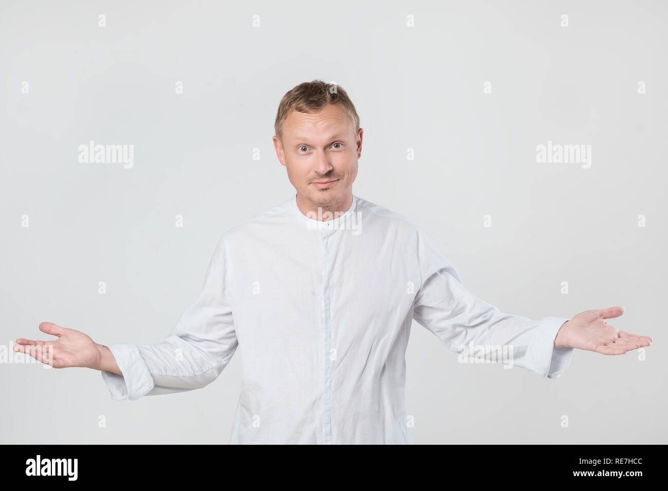 casual young man welcoming you with his arms opened Stock Photo - Alamy