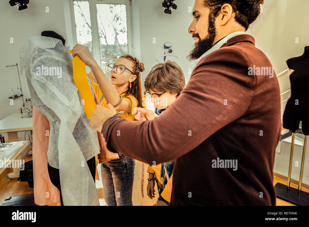 Creative talented family feeling amazing designing clothes together ...