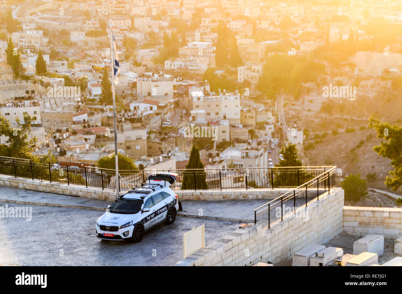 Police car at sunset, behind the old city of Jerusalem Stock Photo - Alamy