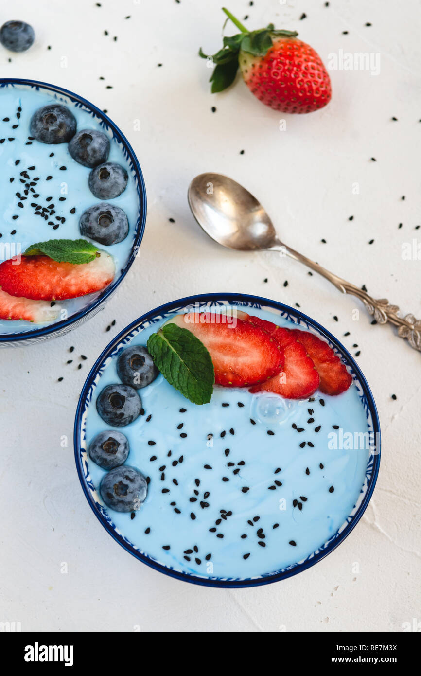 Blue yogurt smoothie made with blue spirulina powder, strawberries and ...