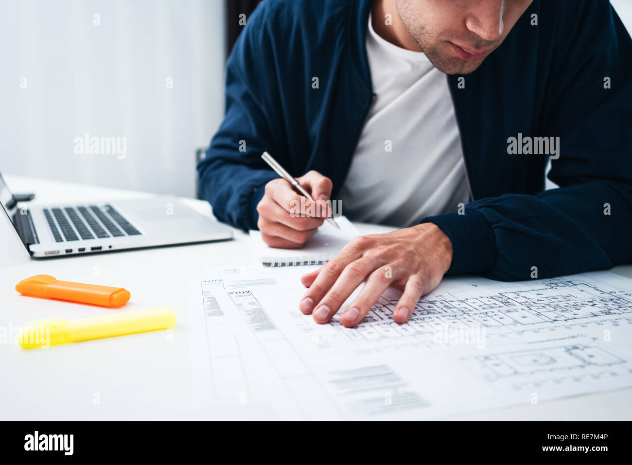 Architect man writing in notepad new ideas and preparing building ...