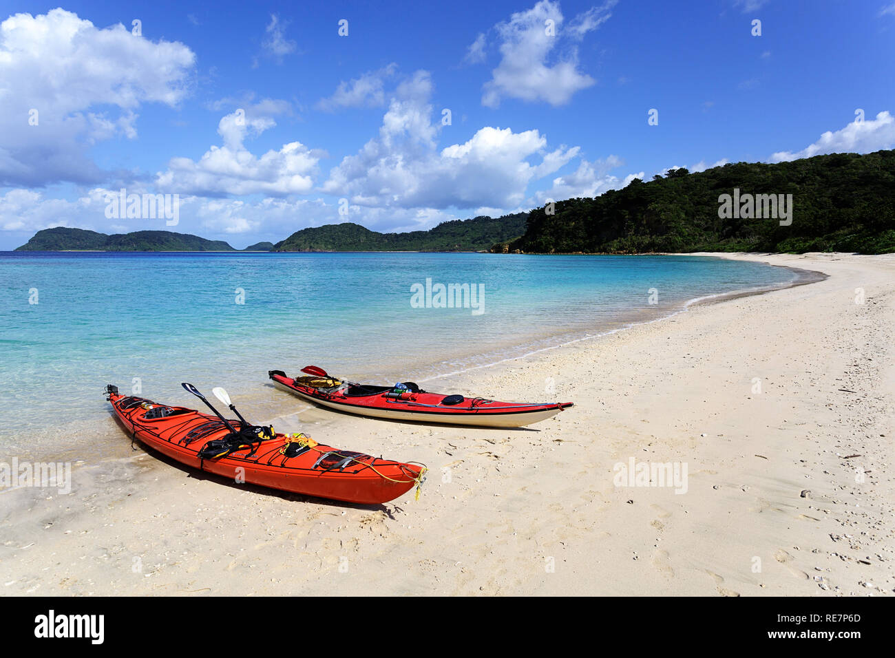 sea kayaks on a beautiful tropical beach with turquoise water, Iriomote ...