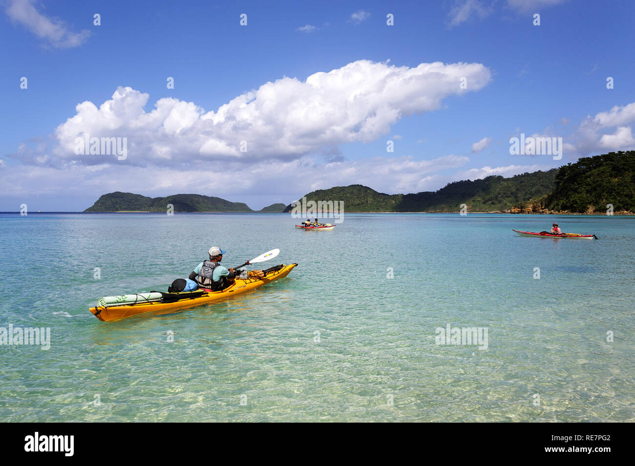 Group of kayakers on a kayaking expedition at tropical islands Stock ...