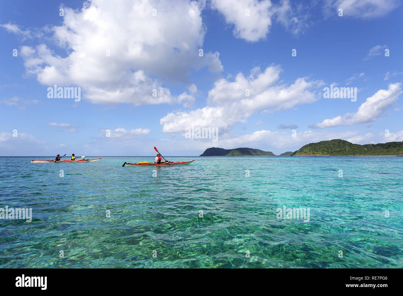 Group of kayakers on a kayaking expedition at tropical islands Stock ...