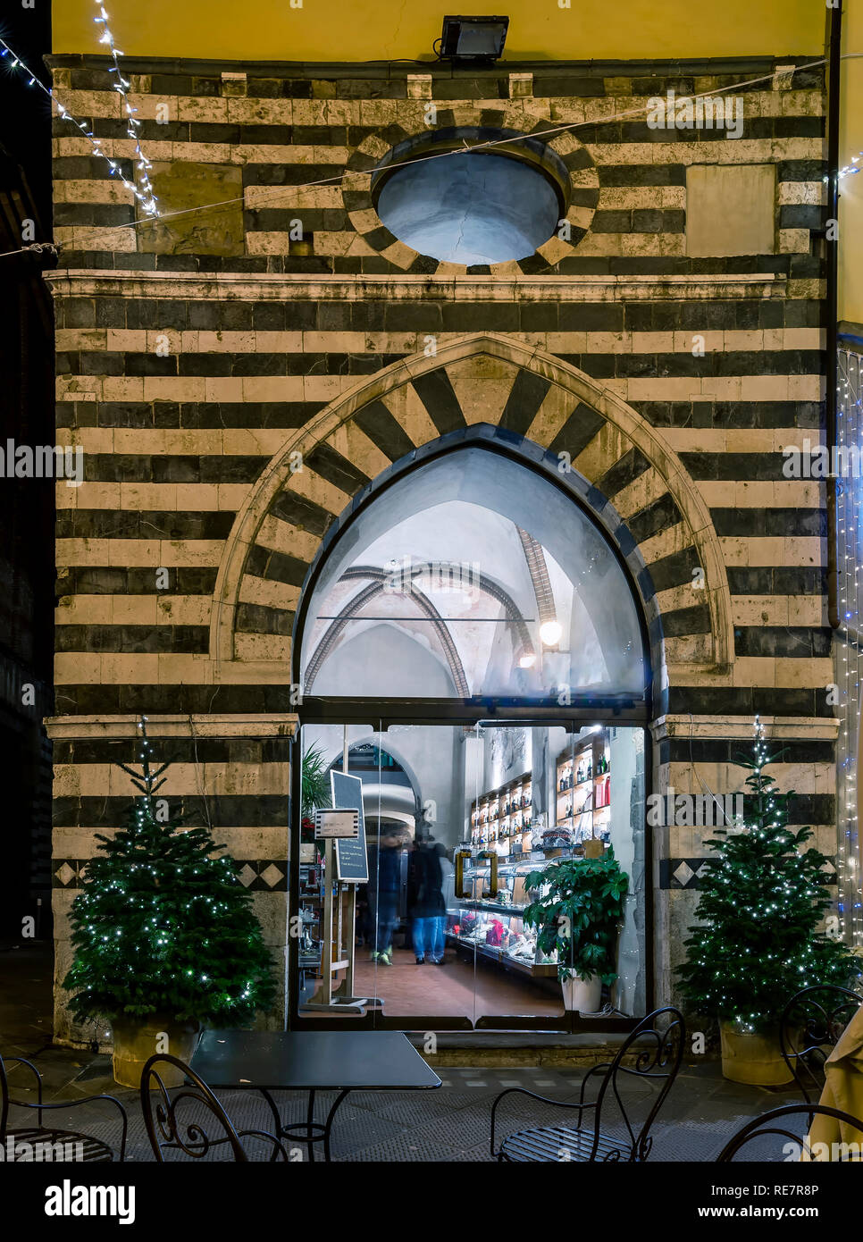 Night view of the ancient oratory in the historic center of Pistoia ...