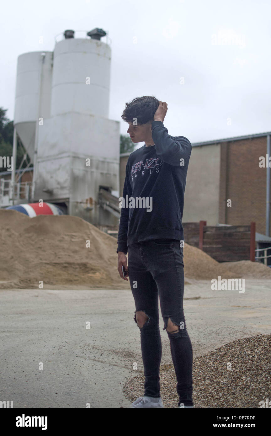 Navy jumper model shoot urban environmentand natural Stock Photo - Alamy