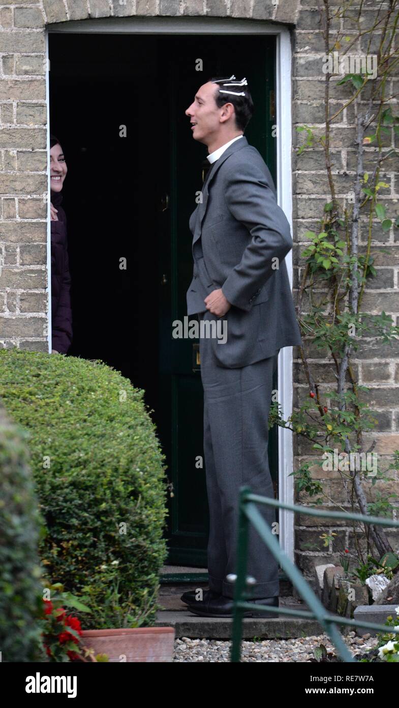 Cast members on set filming the television series in the village of ...