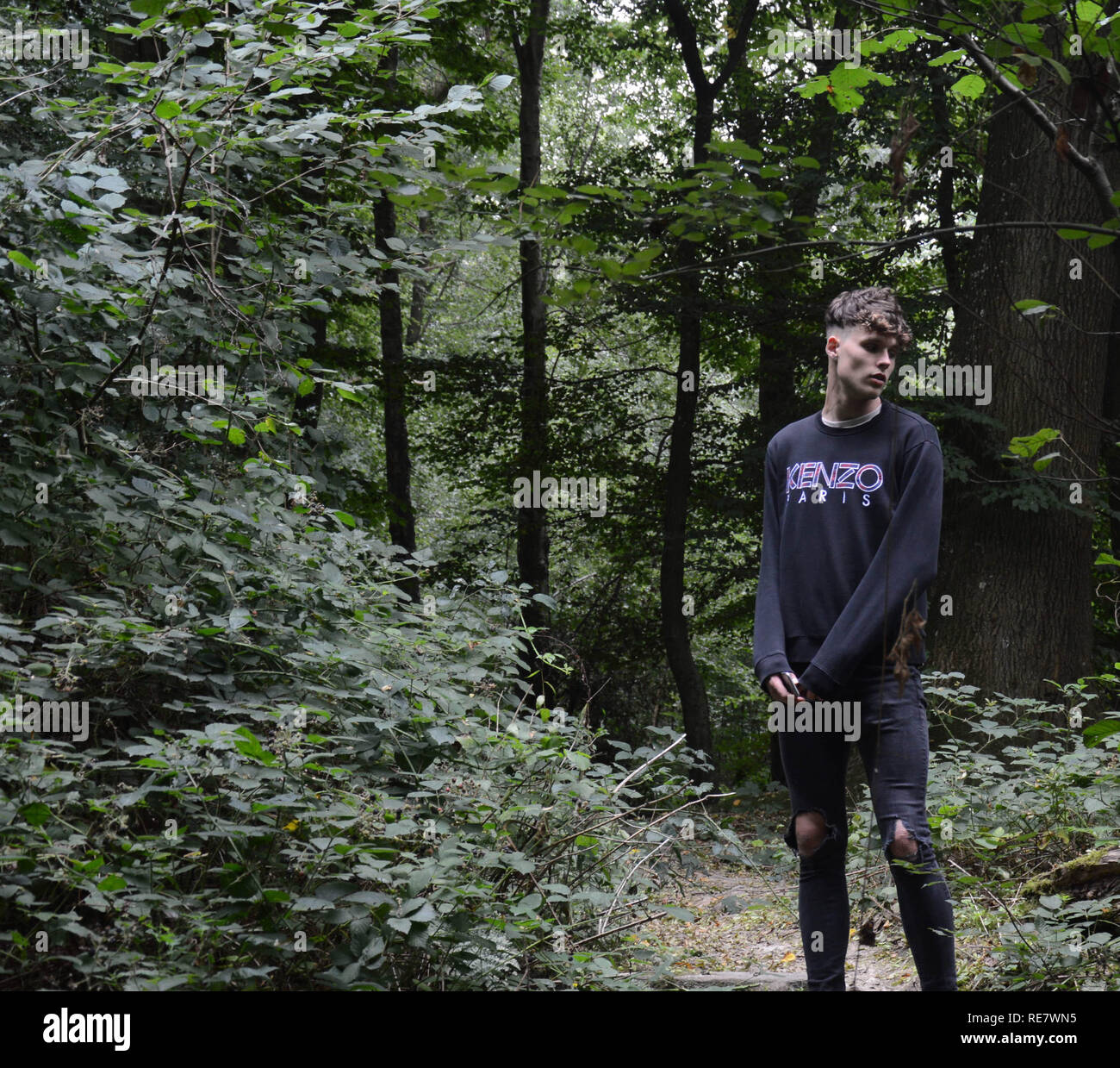 Navy jumper model shoot urban environmentand natural Stock Photo - Alamy