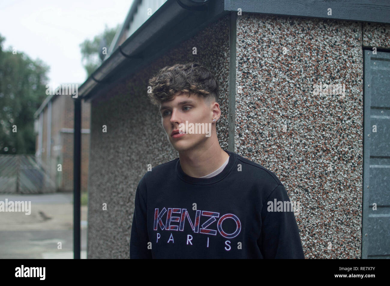 Navy jumper model shoot urban environmentand natural Stock Photo - Alamy