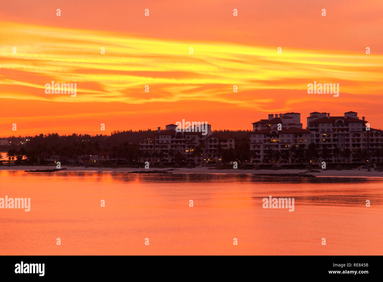 Red color sky and the sea during the sunset over Fisher Island in Miami ...