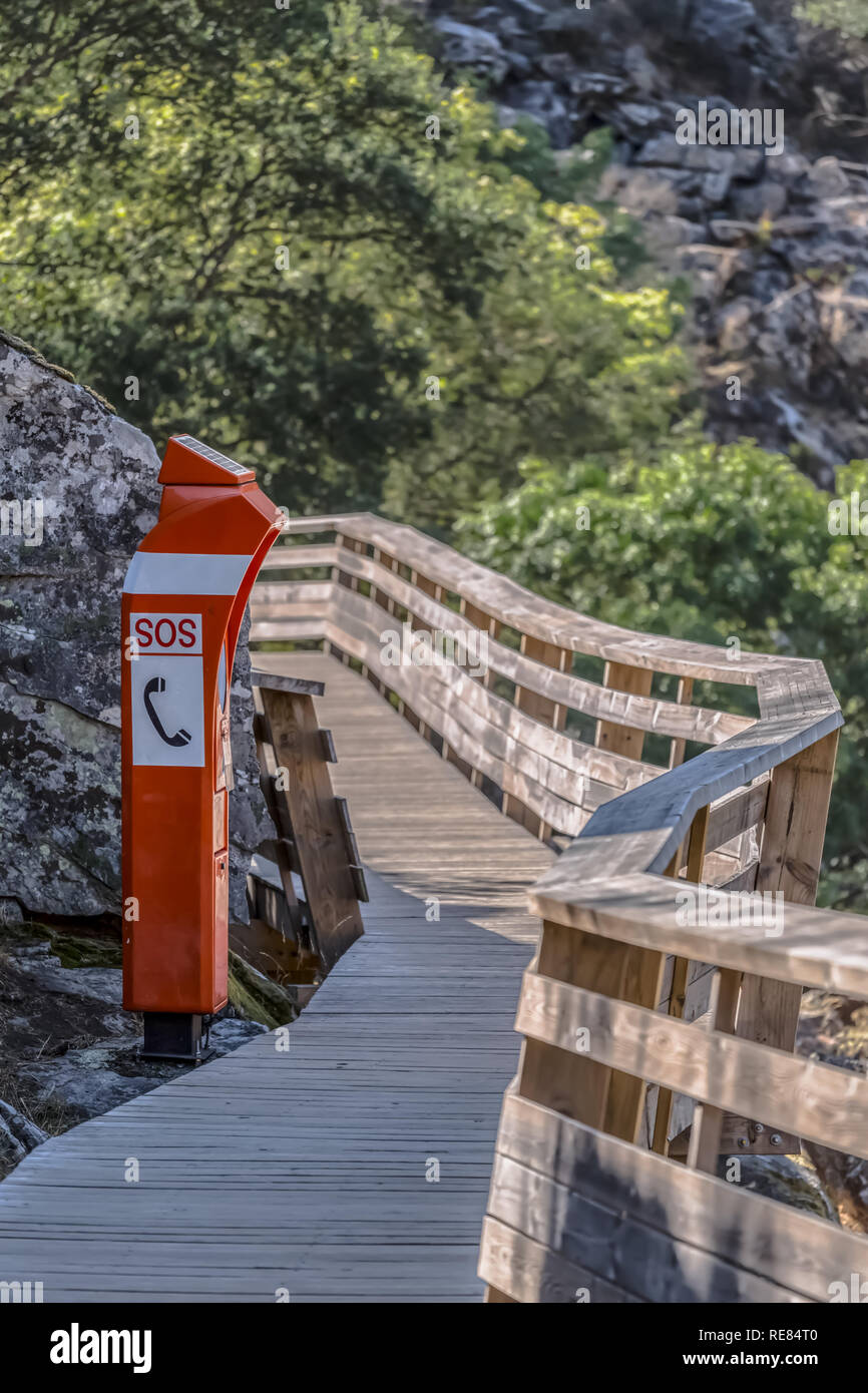 View of wooden suspended pedestrian walkway with a small emergency ...