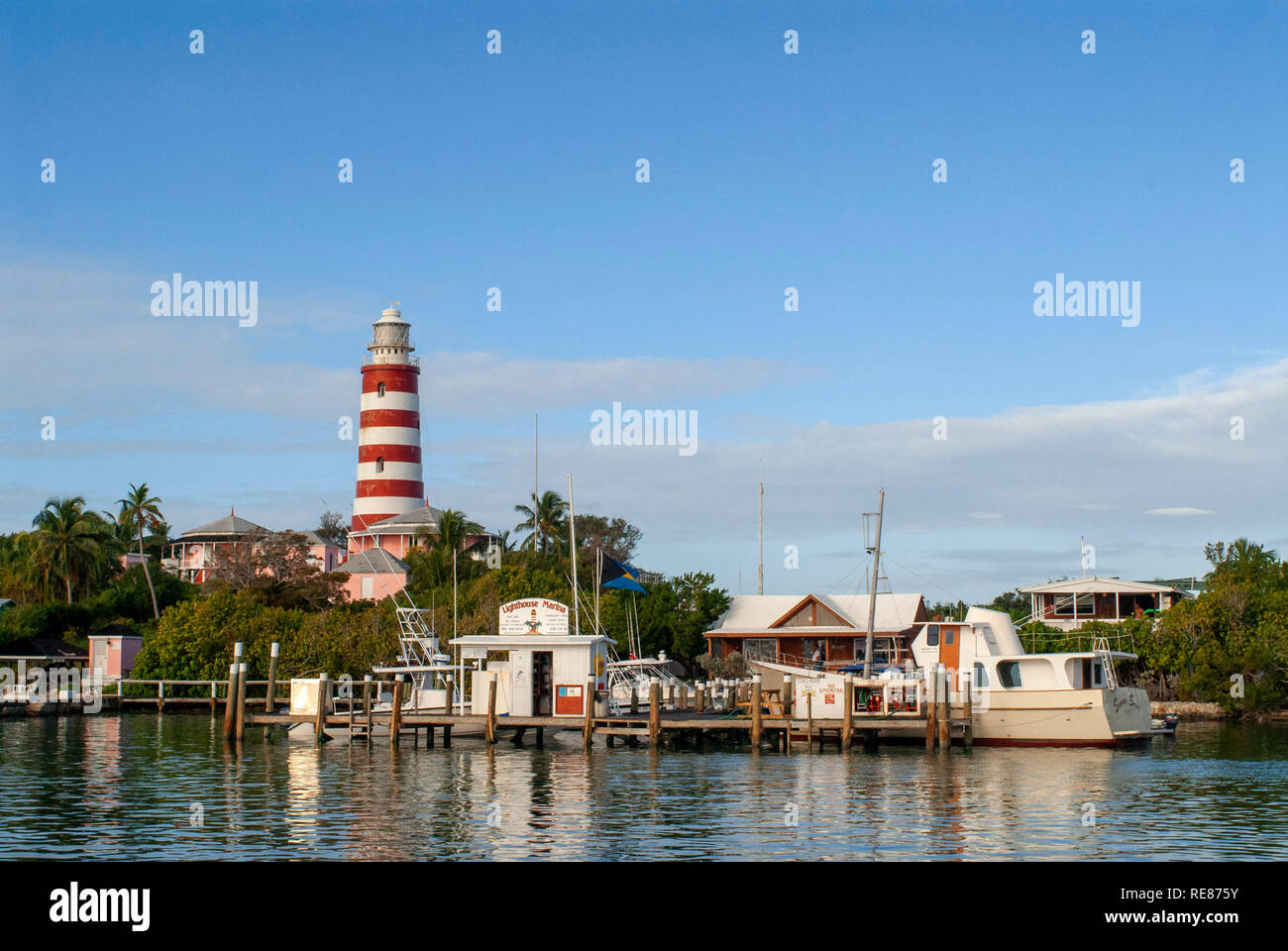 Hope Town lighthouse, Elbow Cay, Abacos. Bahamas. Lighthouse and harbor ...