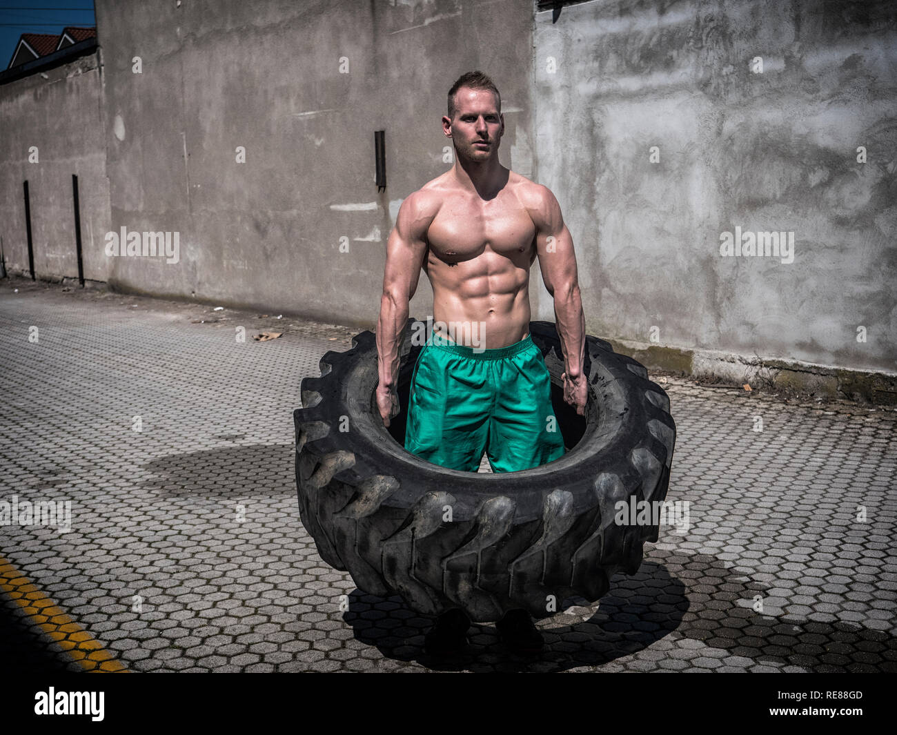 Man flipping tire hi-res stock photography and images - Alamy