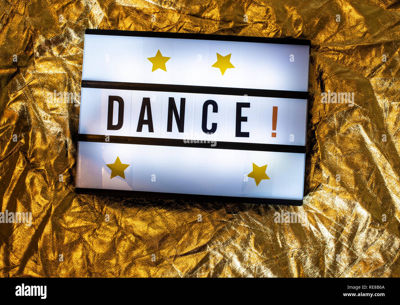 Text Dance on white illuminated board. Conceptual message for ...