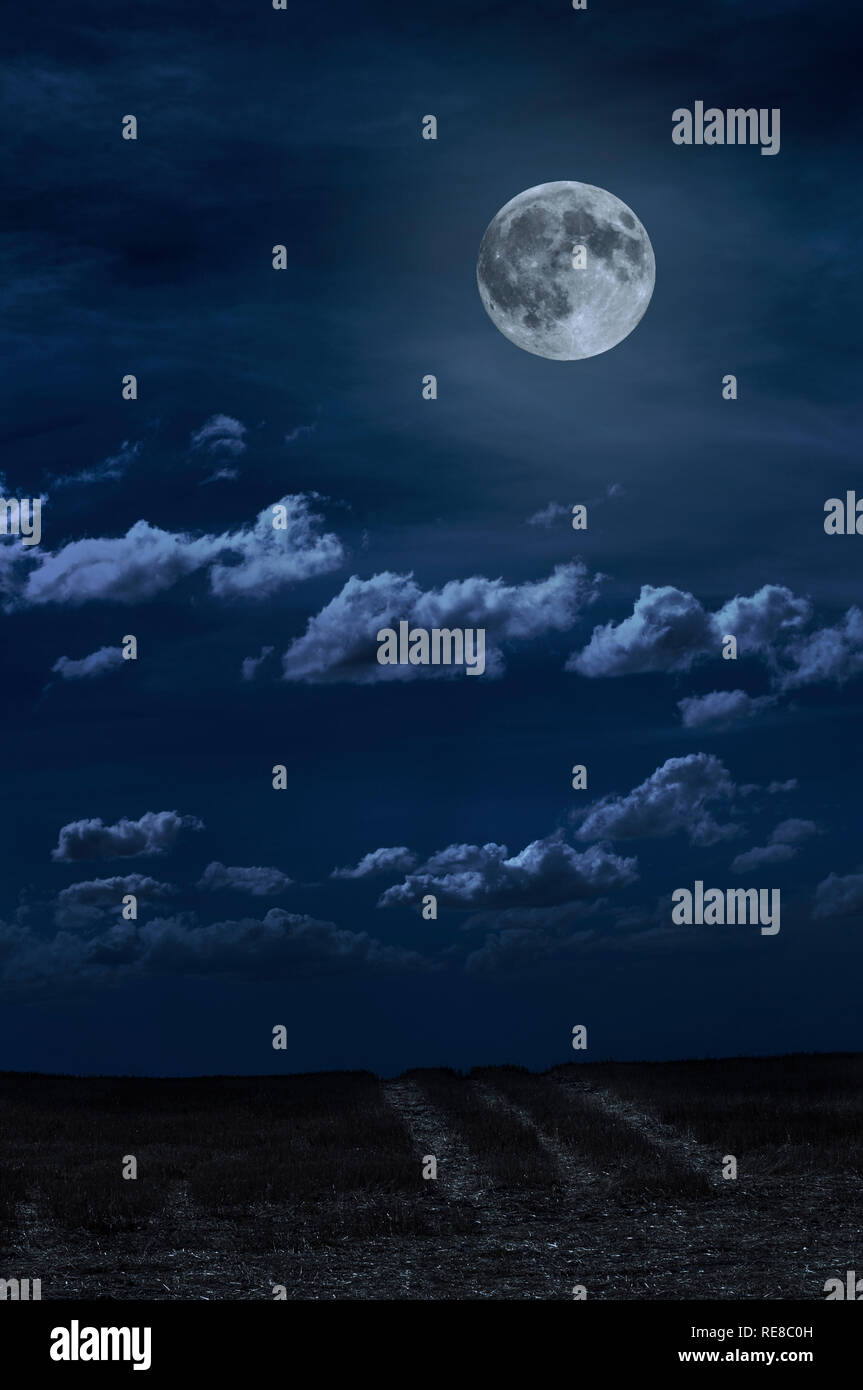 Moon and clouds in the night. Moonlight and road background. Dark blue ...