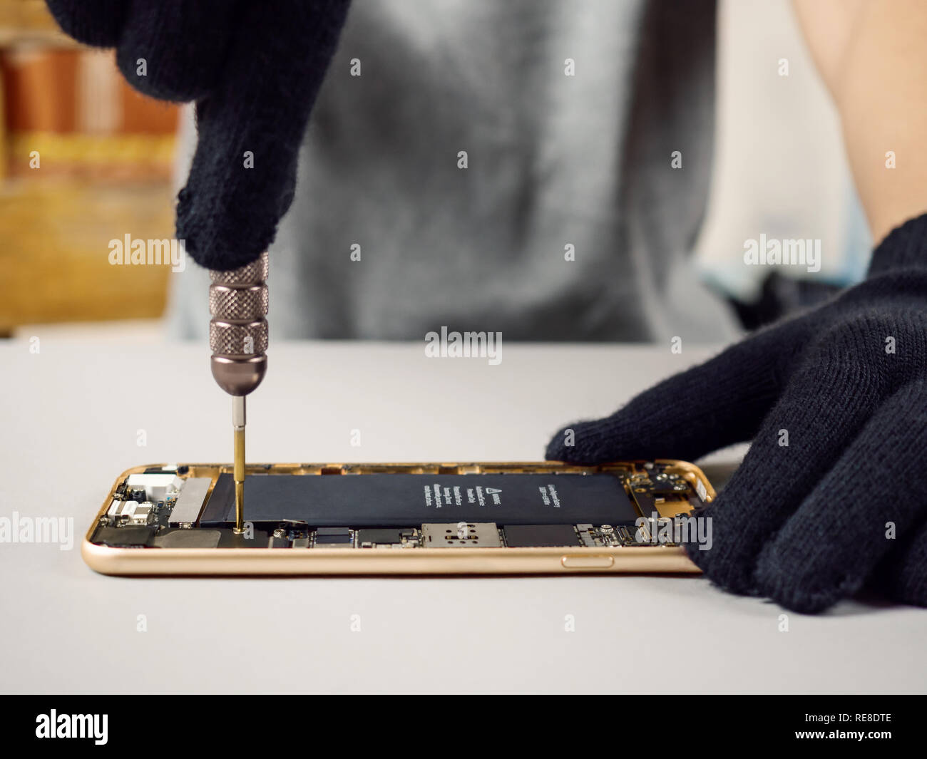 Technician or engineer disassembling components broken smartphone for ...