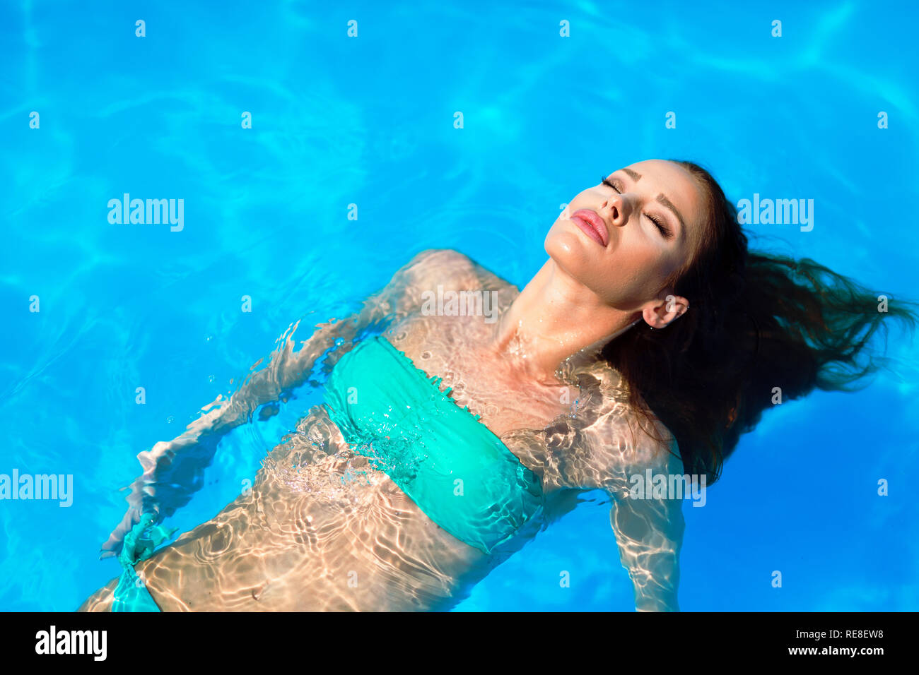 Floating pool lady hi-res stock photography and images - Alamy