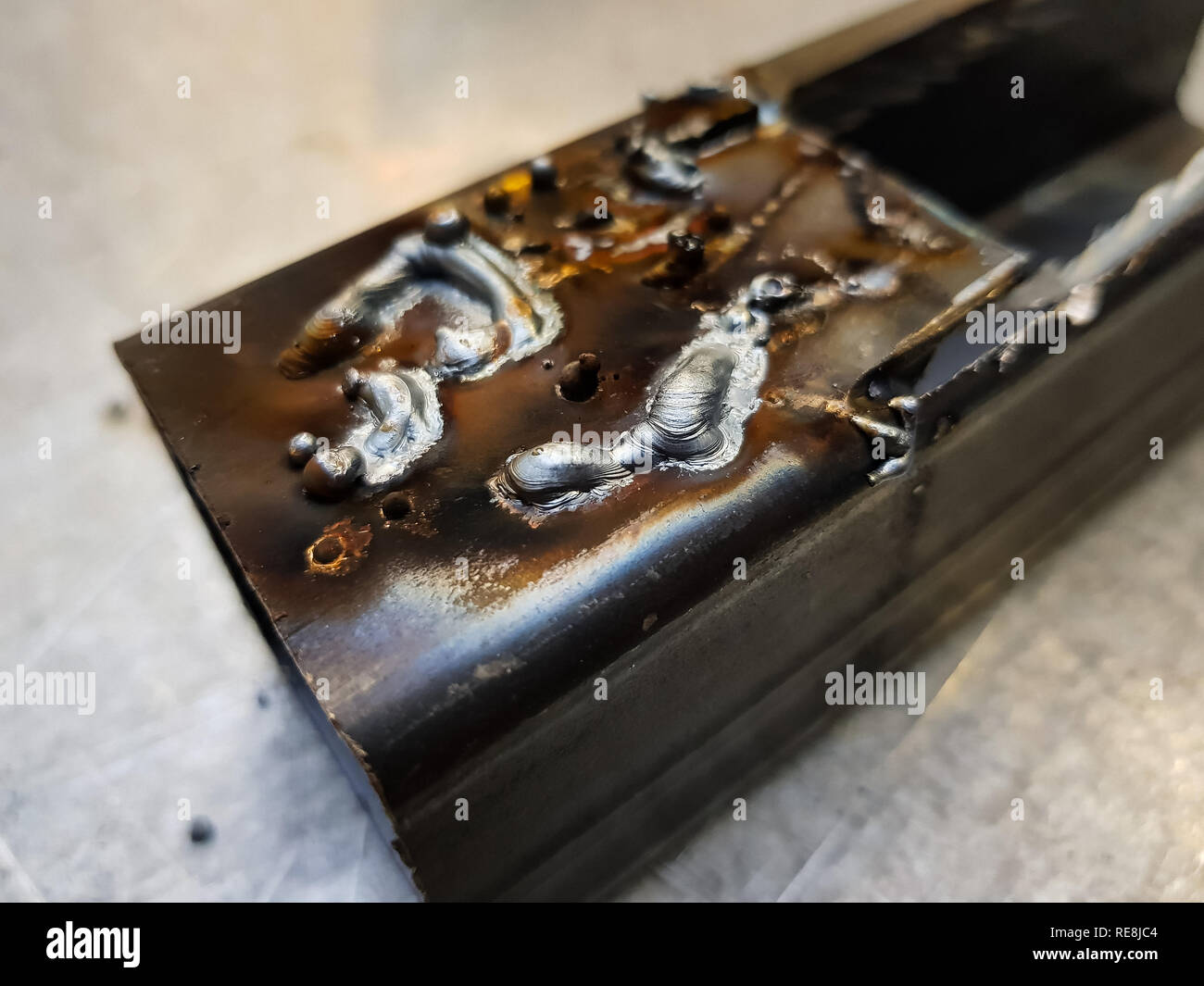Weld spots on rusty brown steel looking like abstract art work Stock ...