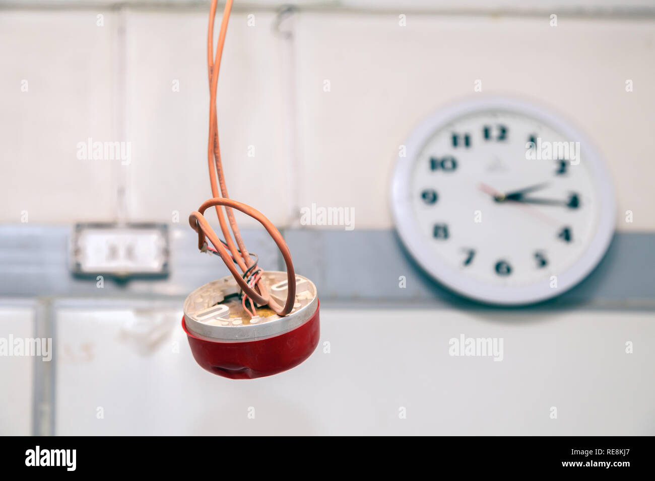 Closeup clock and installation and repair of electric cable, smoke ...