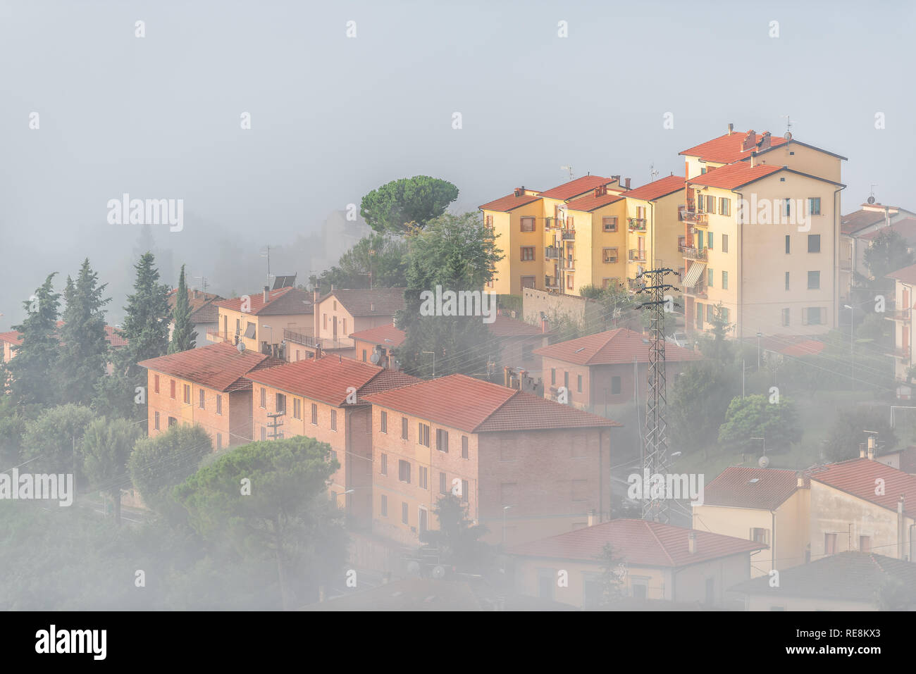 Chiusi Scalo mist fog sunrise of rooftop houses buildings in Umbria ...