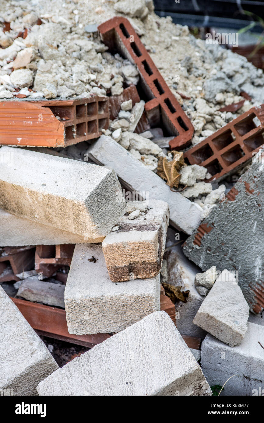 Background of building rubble with terracotta bricks and other white ...