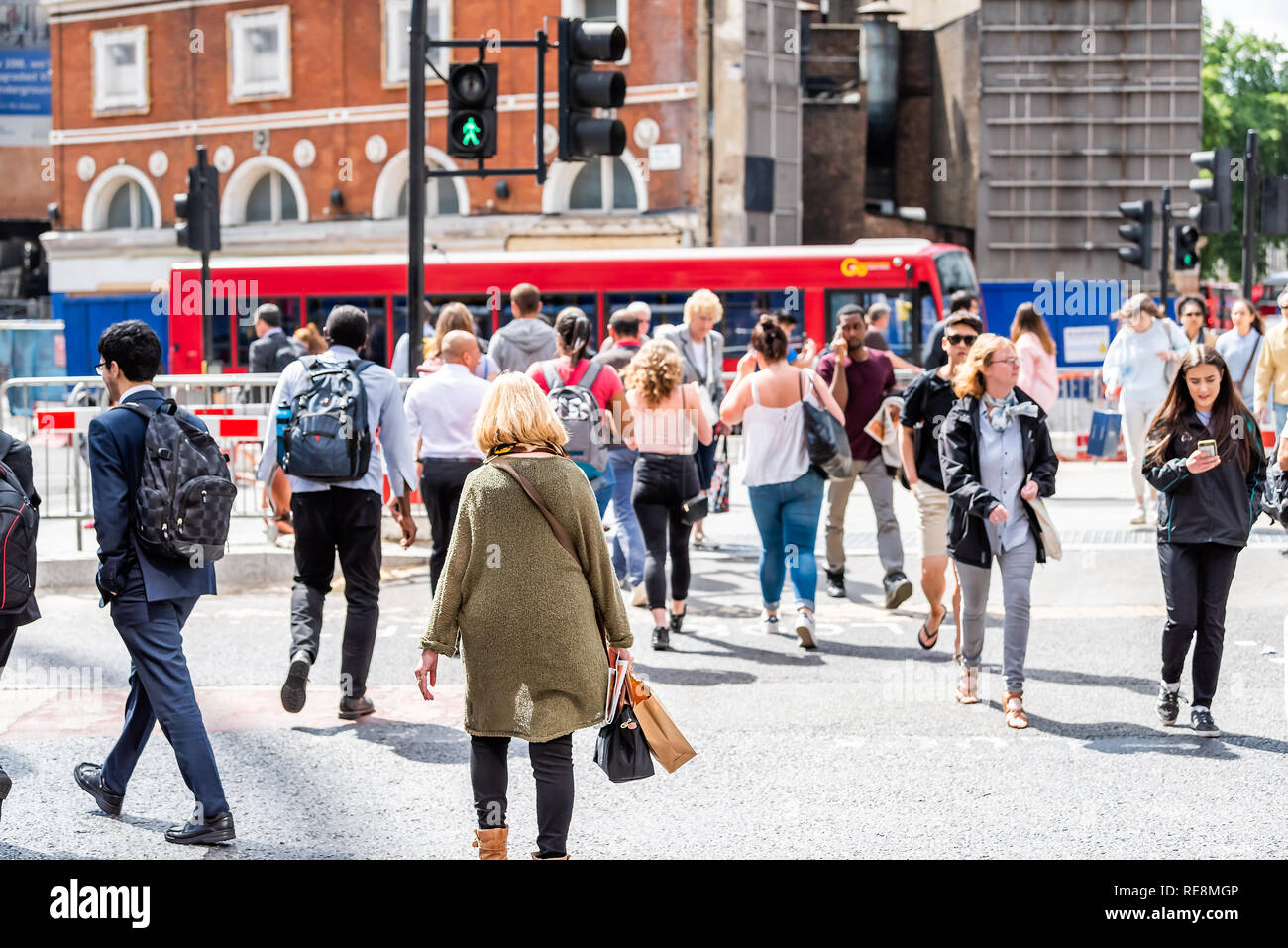 London, UK - June 21, 2018: Many people, crowd of pedestrians crossing ...