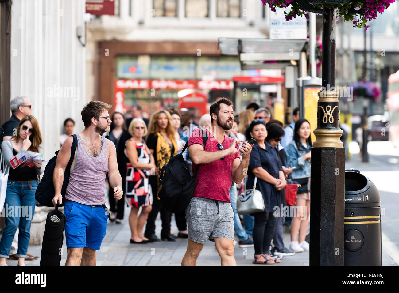 London, UK - June 21, 2018: Crowd of many people pedestrians young men ...