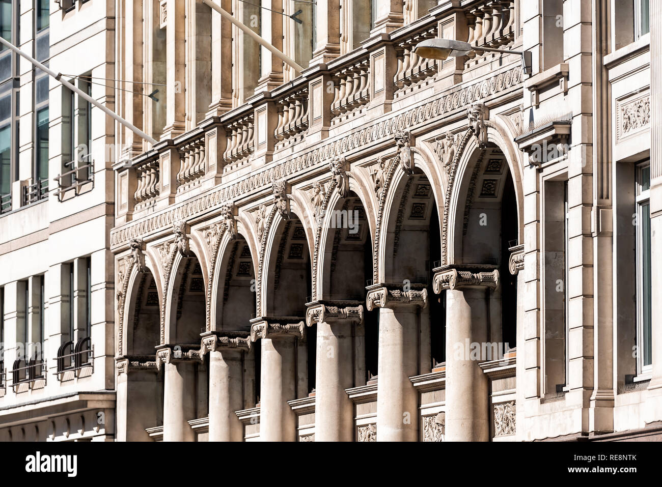 London, UK city with exterior facade view of arch colonnade columns ...