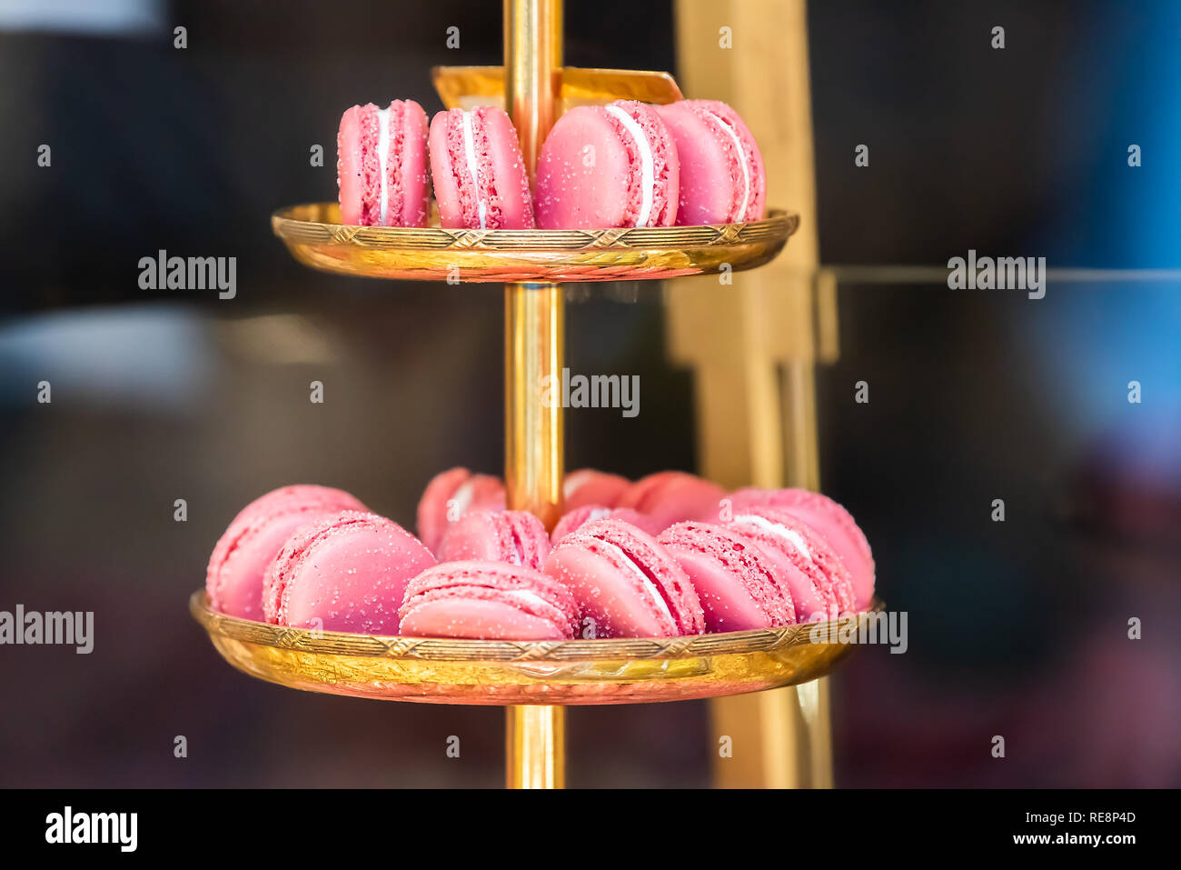 Display of pile of gourmet colorful pink with white filling cream ...