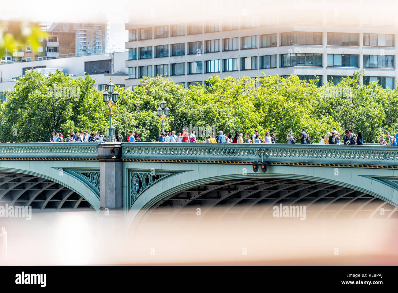 London, UK - June 22, 2018: People crowd walking on city bridge with ...