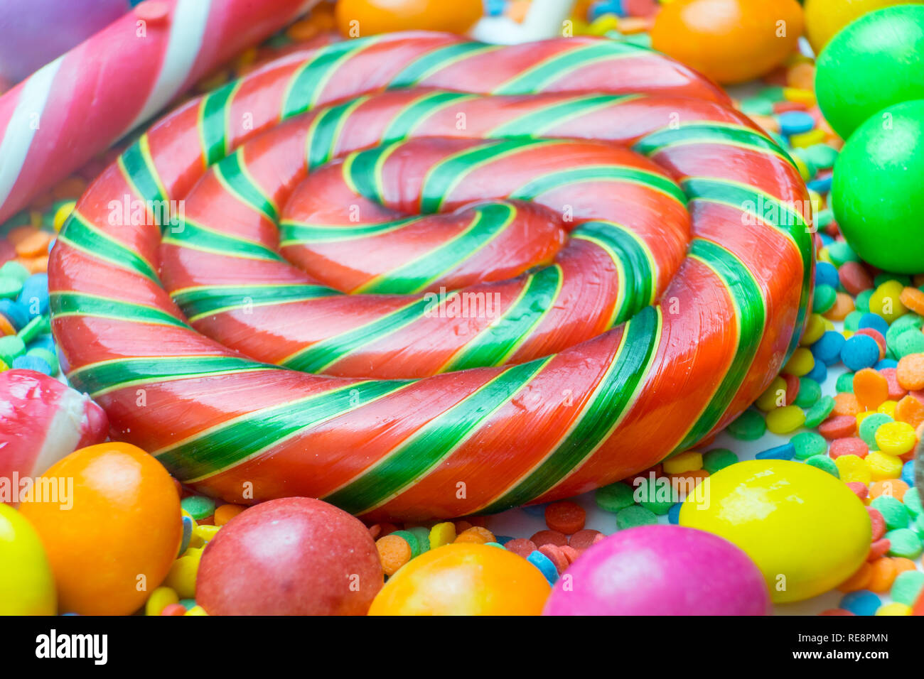 backdrop from different colorful sweets and lollipops Stock Photo - Alamy
