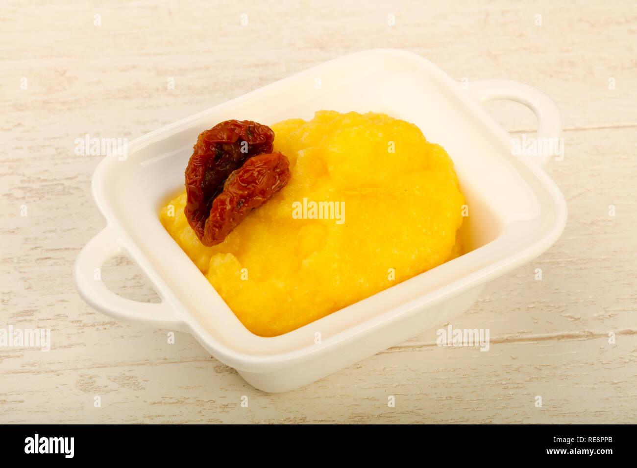 Polenta with dry tomato Stock Photo - Alamy