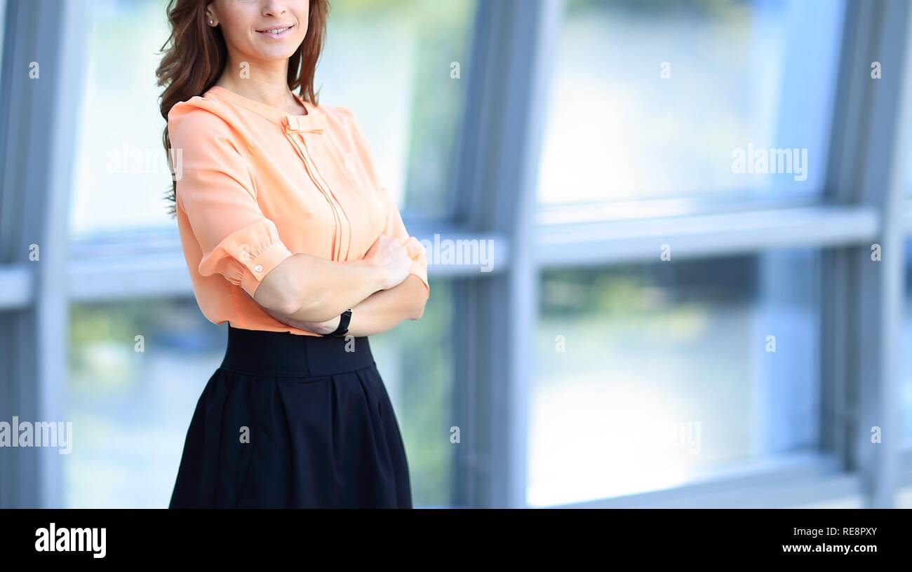 modern business woman standing near a large window in the office Stock ...
