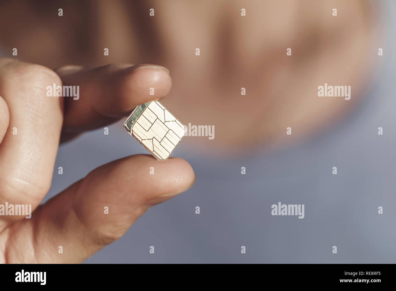 Sim card in hand with copy space, close-up Stock Photo - Alamy