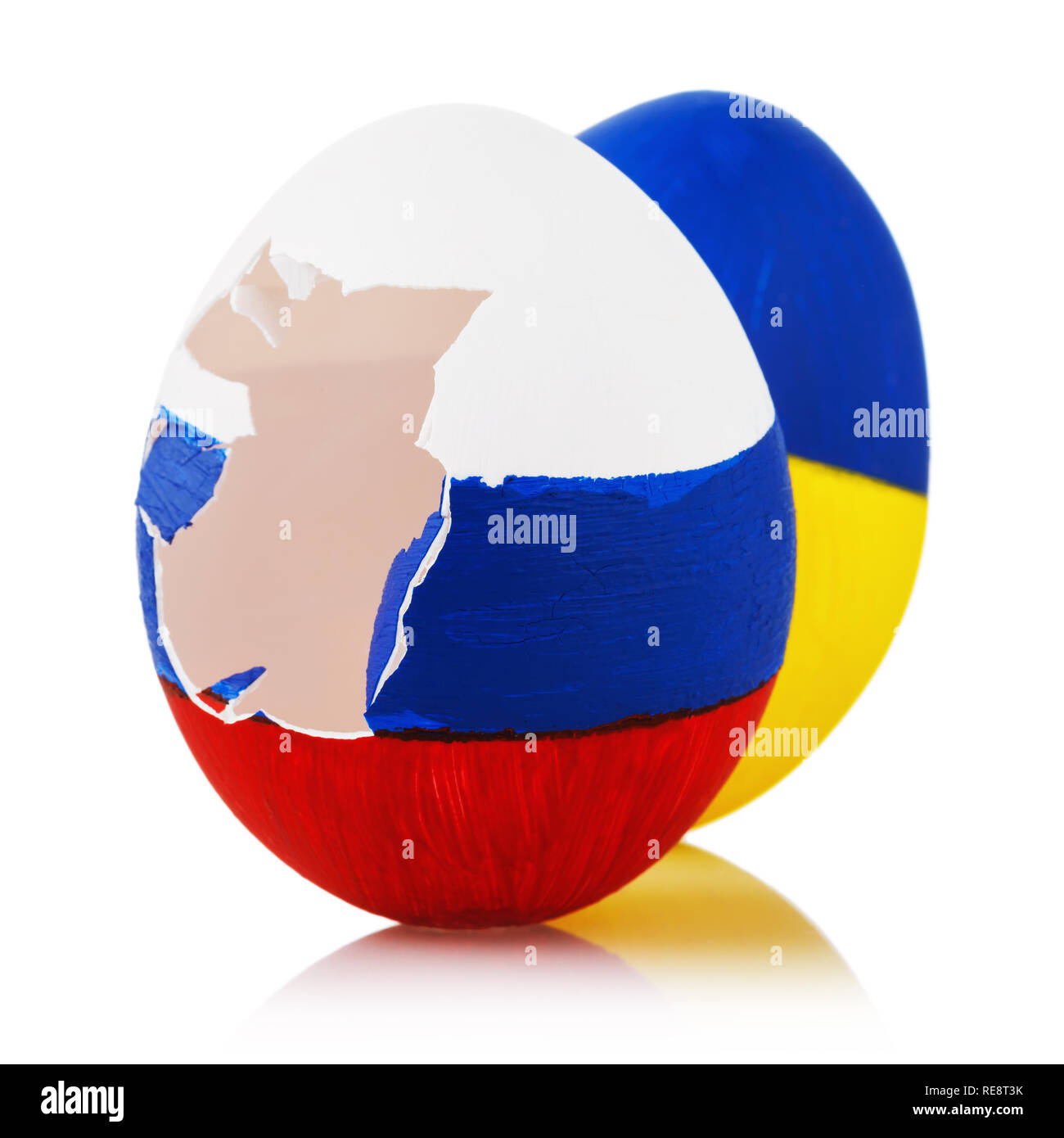 Two Easter eggs painted in color of flags of Russia and Ukraine ...