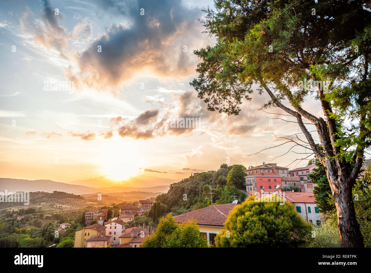 Chiusi sunset evening in Umbria, Italy with rooftop houses on mountain ...