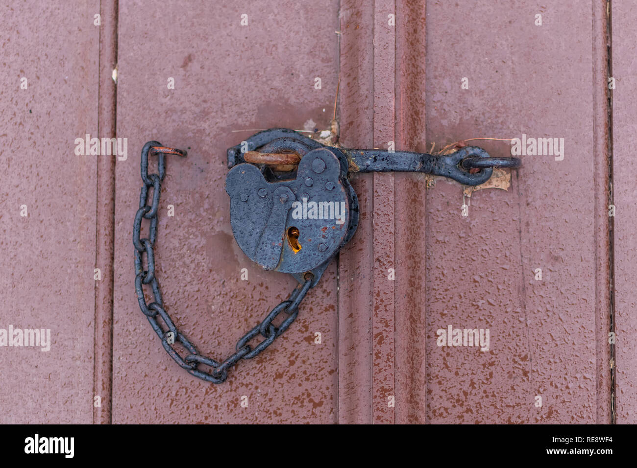 An antique colonial style padlock Stock Photo - Alamy
