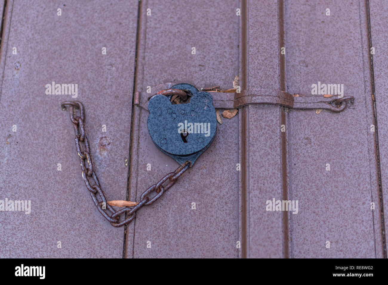 An antique colonial style padlock Stock Photo - Alamy