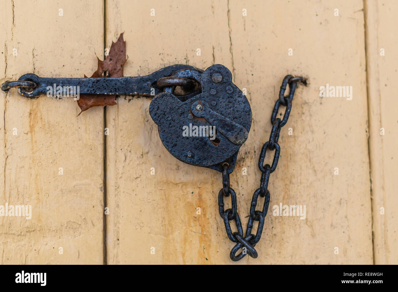 An antique colonial style padlock Stock Photo - Alamy