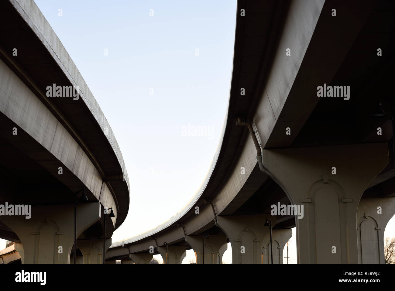 Transportation infrastructure, underneath a pair of curved elevated ...