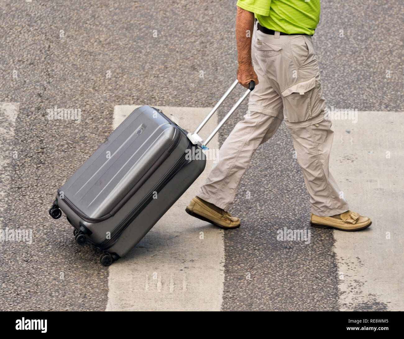 adult male walking with luggage Stock Photo - Alamy