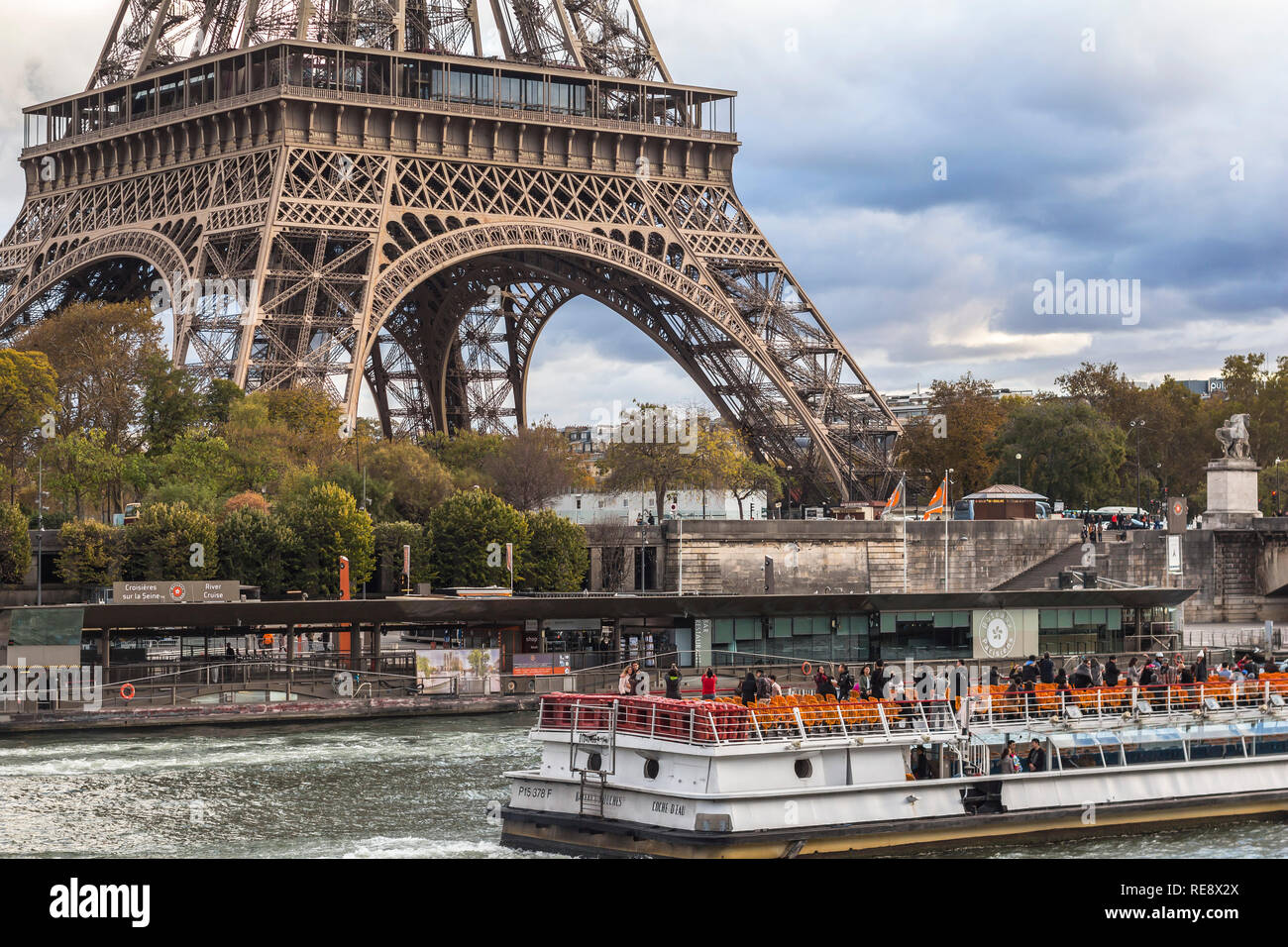 Tourist boat on Seine river with Eiffel tower in Paris Stock Photo - Alamy